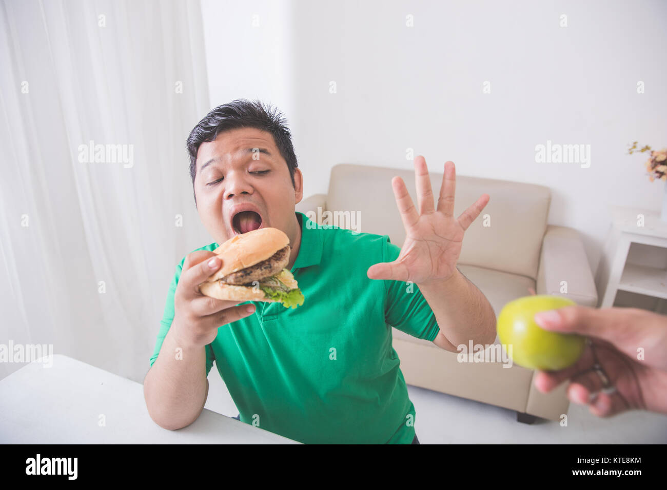man refuse to eat healthy Stock Photo - Alamy