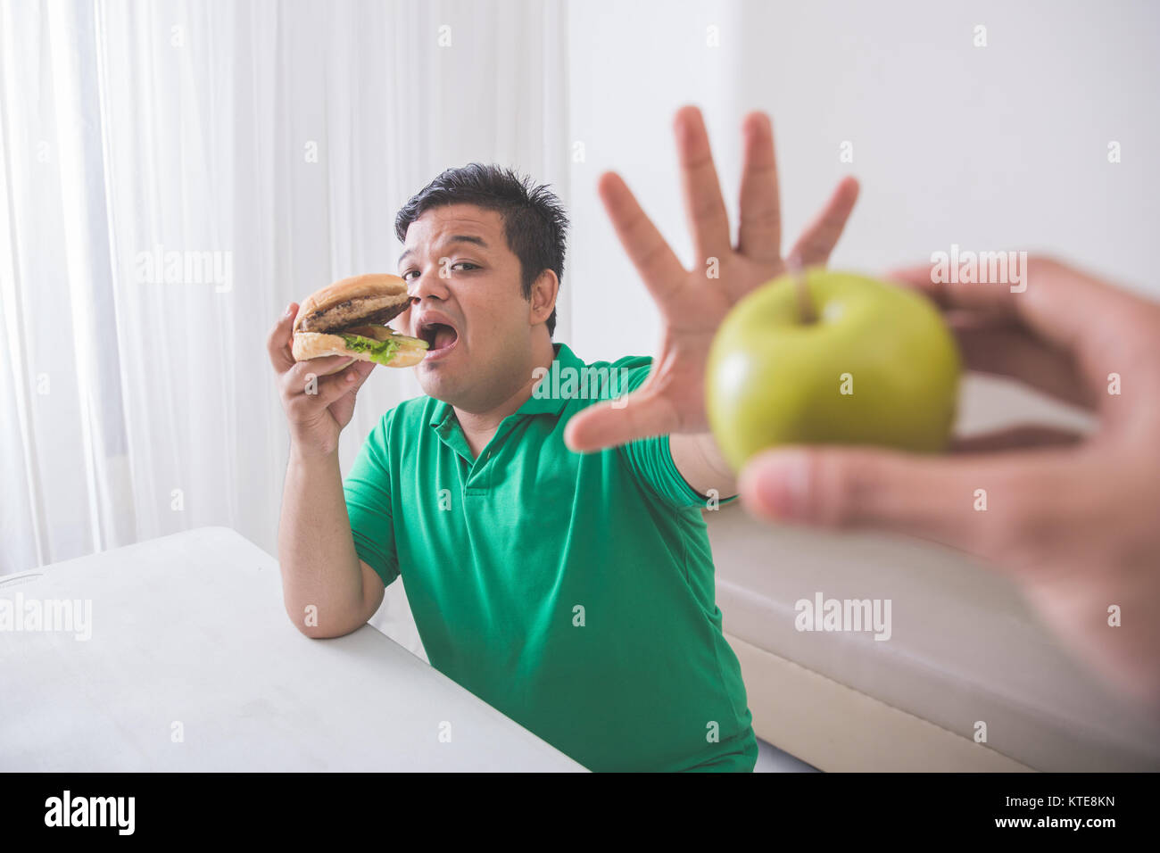man refuse to eat healthy Stock Photo - Alamy