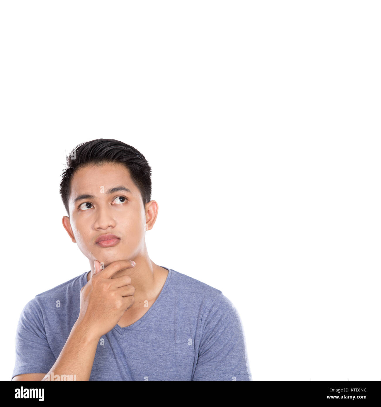 Young asian man thinking looking up isolated Stock Photo - Alamy