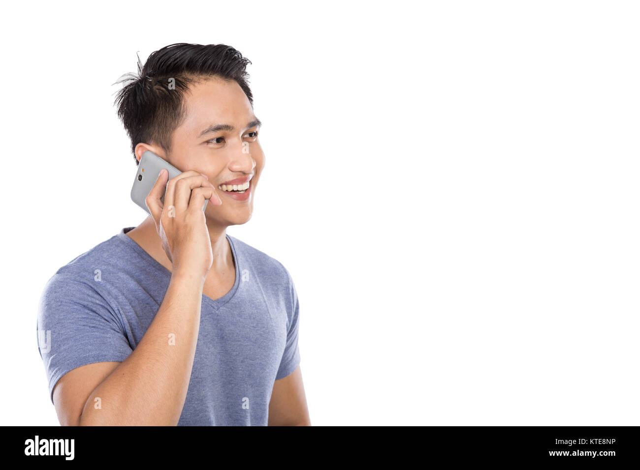 Asian young man talking on a phone isolated on white background Stock ...