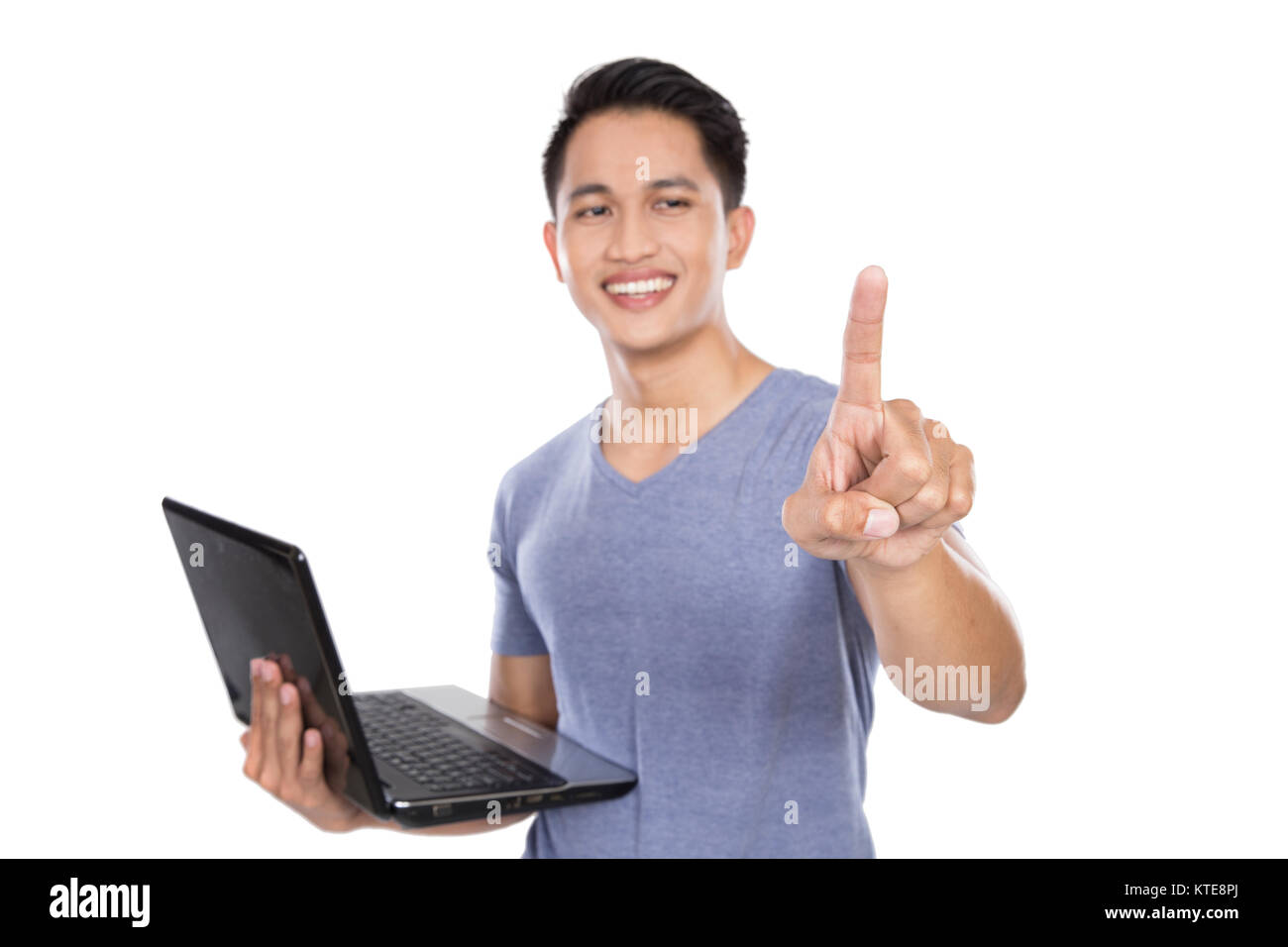Young asian man standing with a laptop open, gesture of hand tou Stock ...