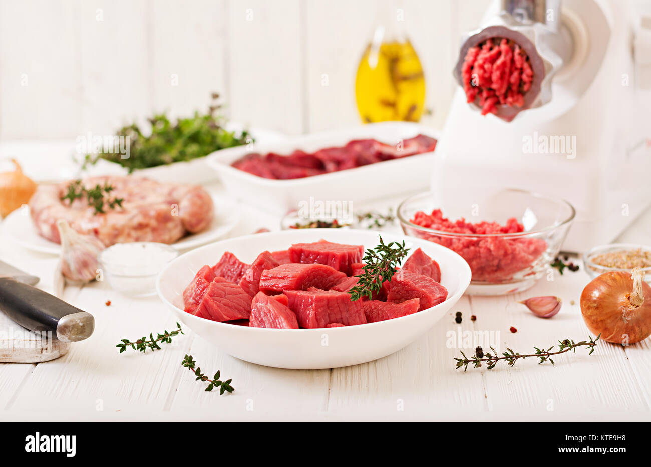 Chopped raw meat. The process of preparing forcemeat by means of a meat ...