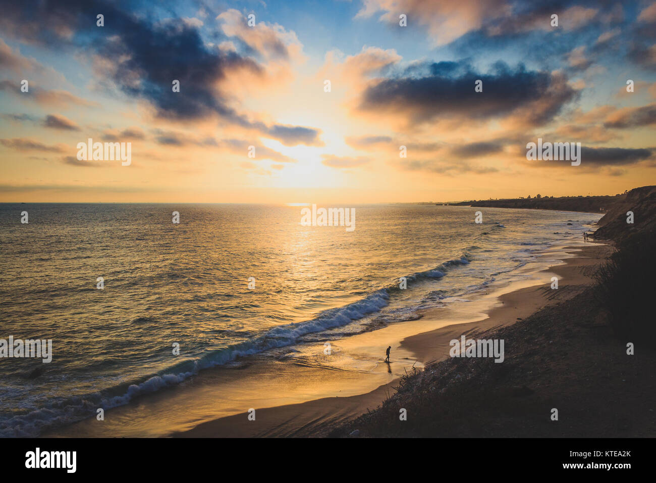 Magnificent coastline view of Crystal Cove beach at sunset with clouds ...