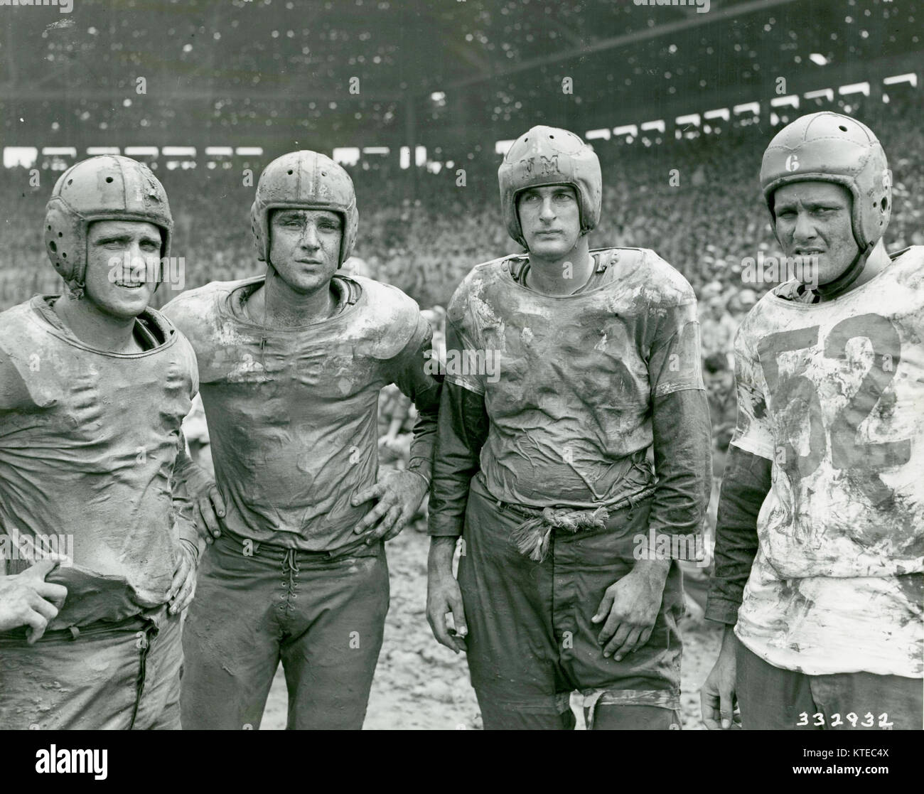 American football players covered in mud after playing a game on a ...