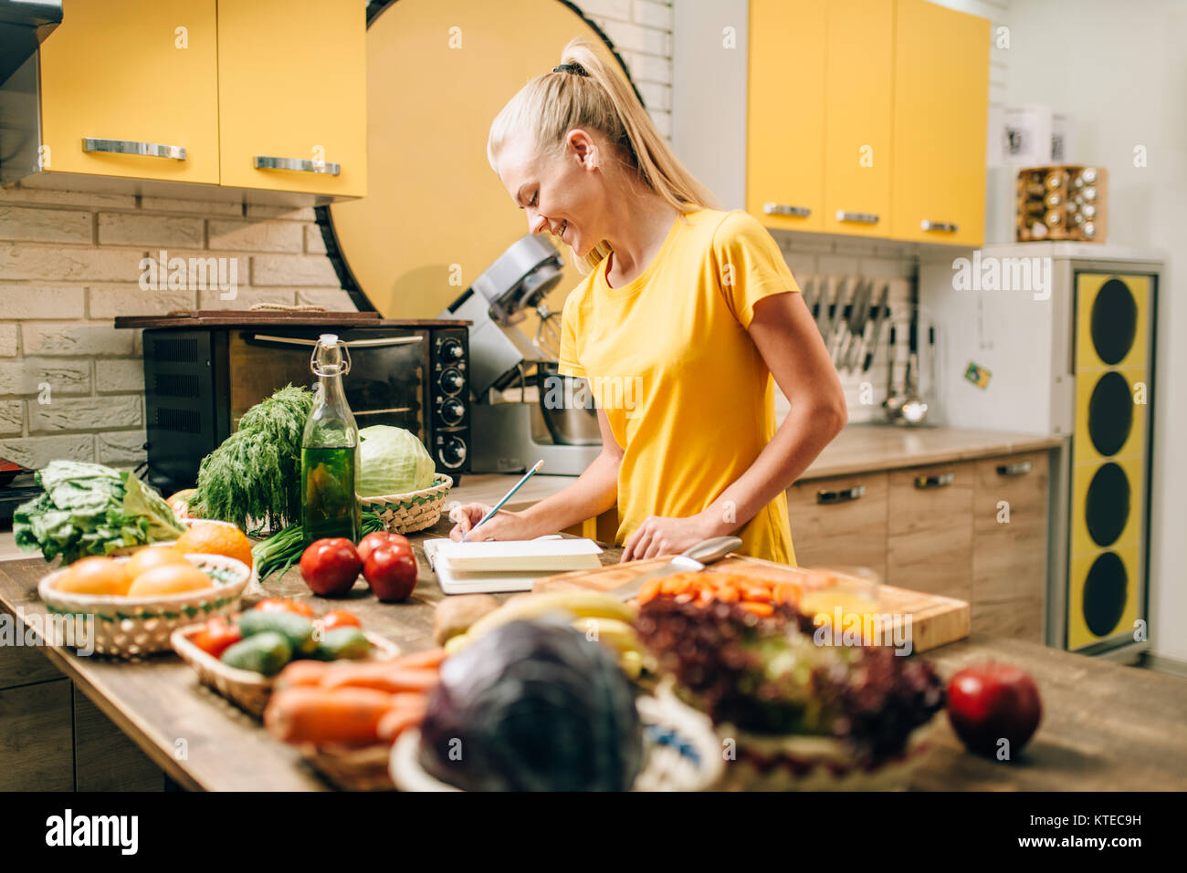 Female person cooking on the kitchen, healthy organic food. Vegetarian ...