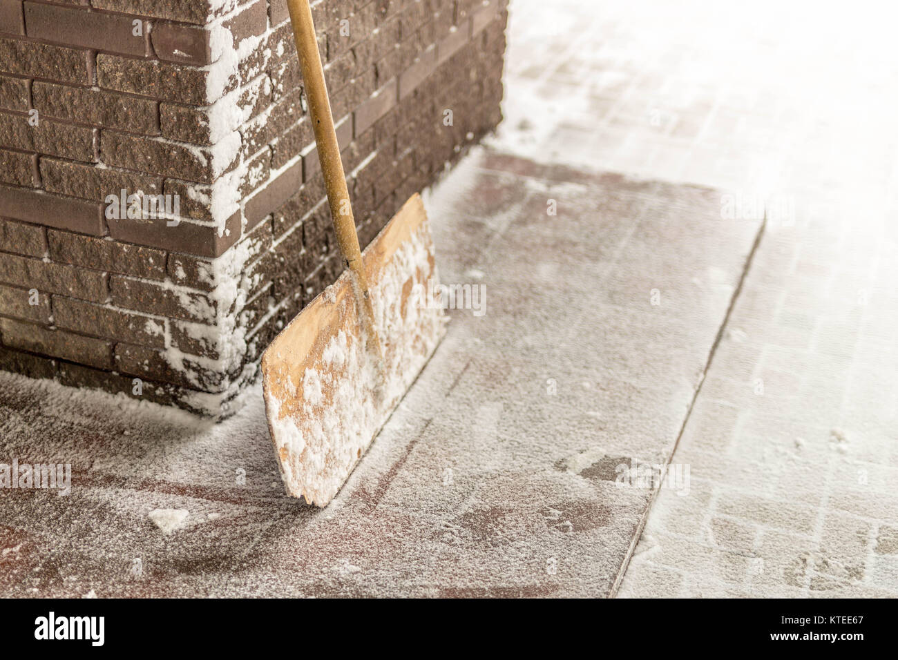 snow showel on a porch during snowfall Stock Photo - Alamy