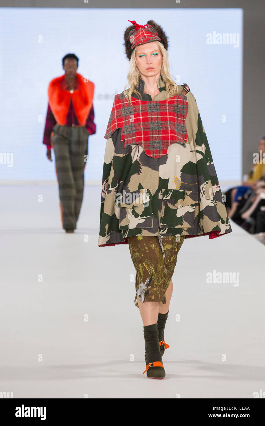 A model walks the runway wearing a collection created by Ellen Reed ...