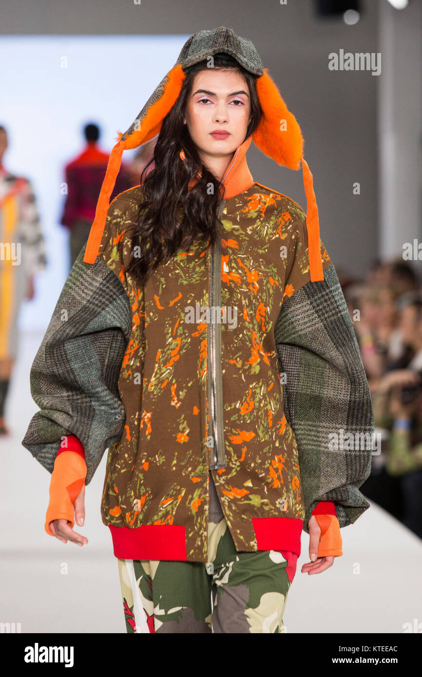 A model walks the runway wearing a collection created by Ellen Reed ...