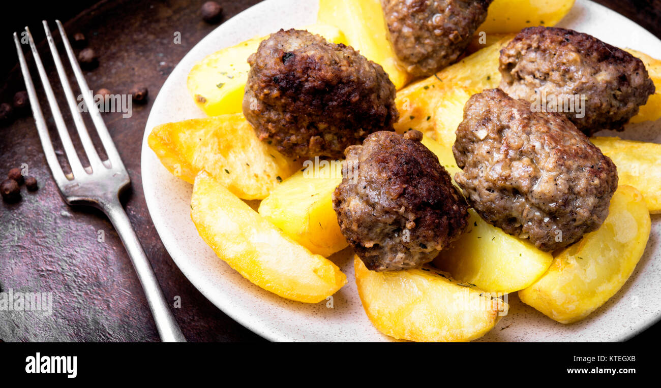 Fried beef cutlets with baked potatoes, according to a homemade recipe ...