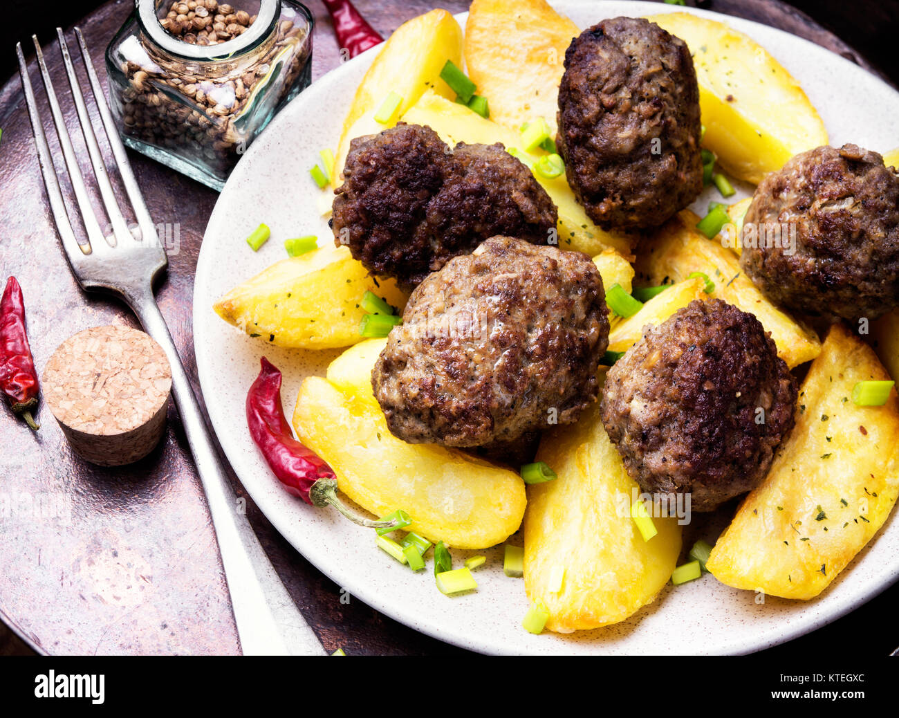 Fried beef cutlets with baked potatoes, according to a homemade recipe ...