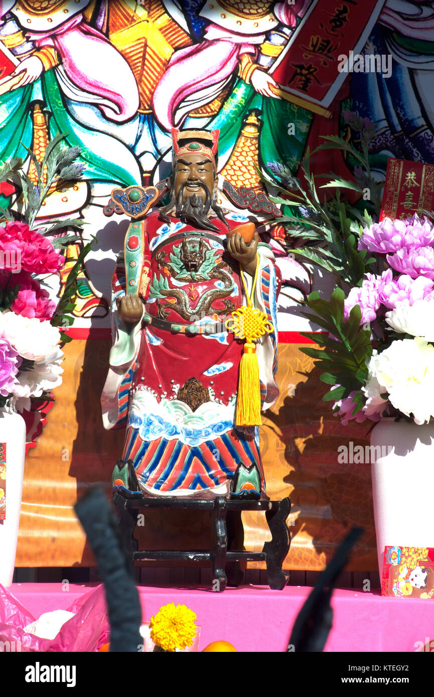 Statue of Chinese God Guan YU on God altar table on the street of ...
