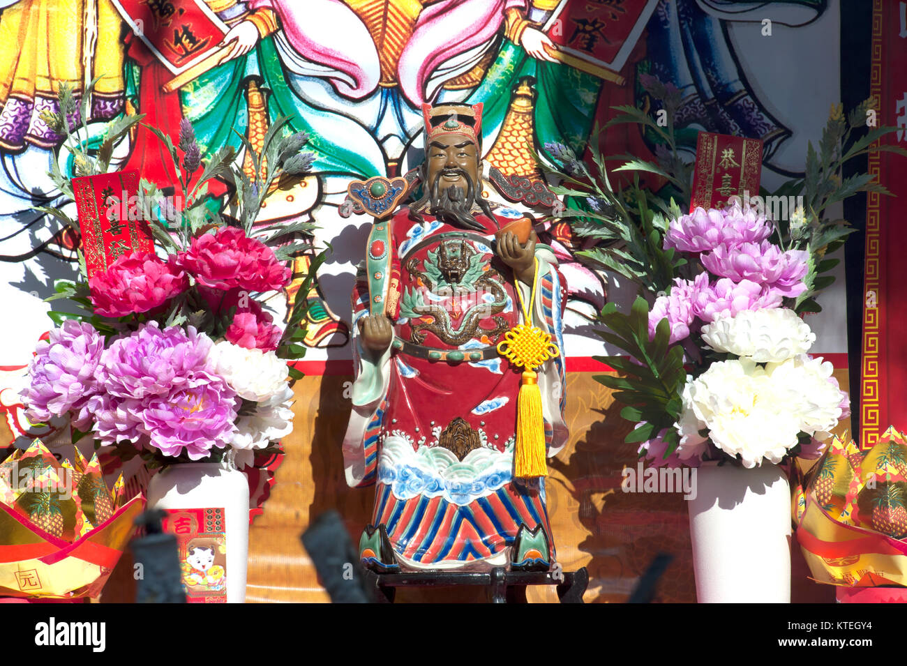 Statue of Chinese God Guan YU on God altar table on the street of ...