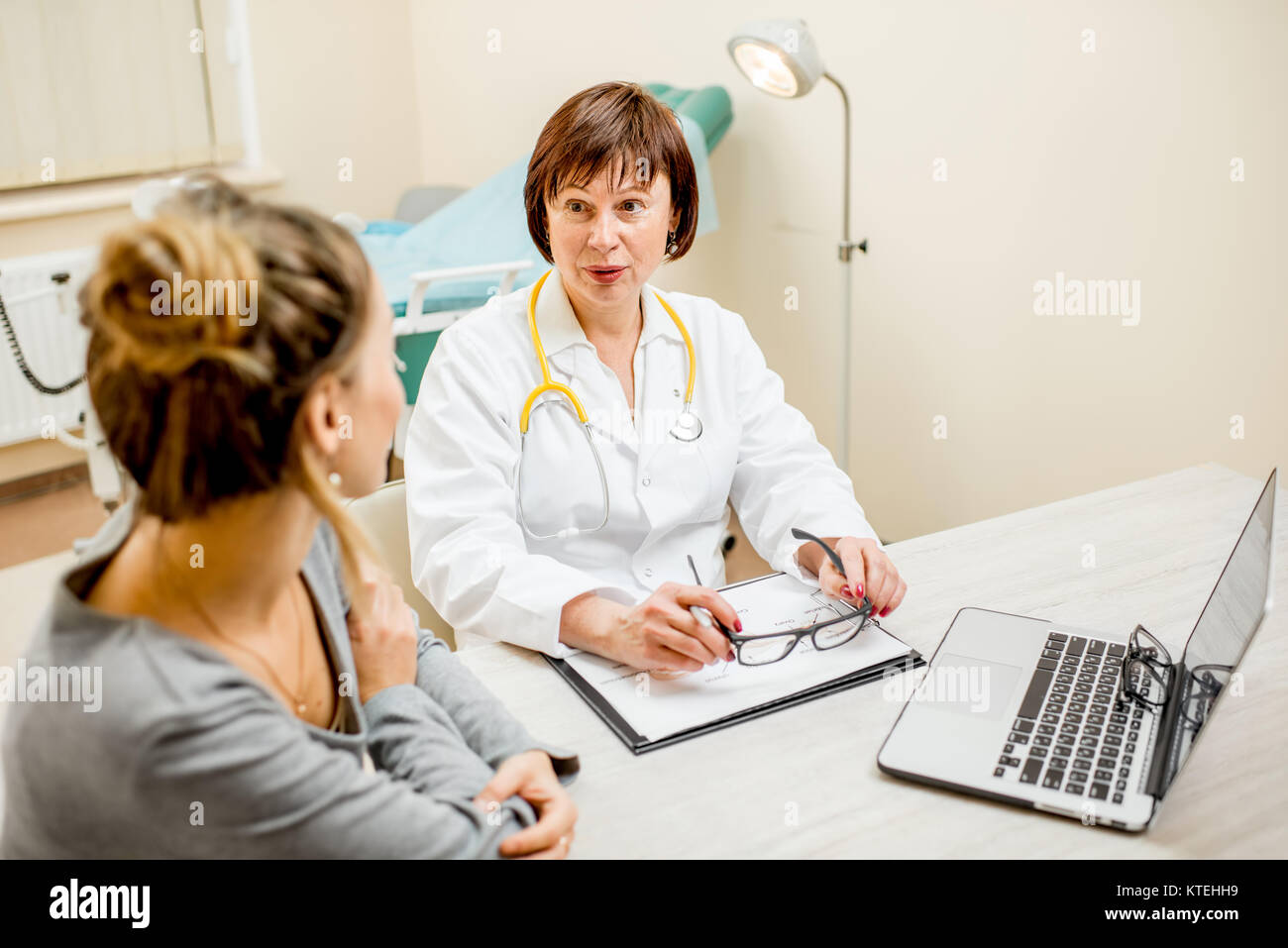 Young woman patient with a senior gynecologist during the consultation ...