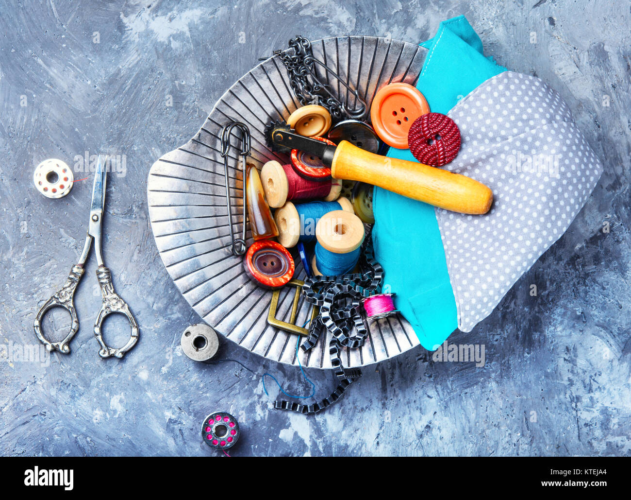 Stylish metal vase with set of sewing accessories Stock Photo - Alamy