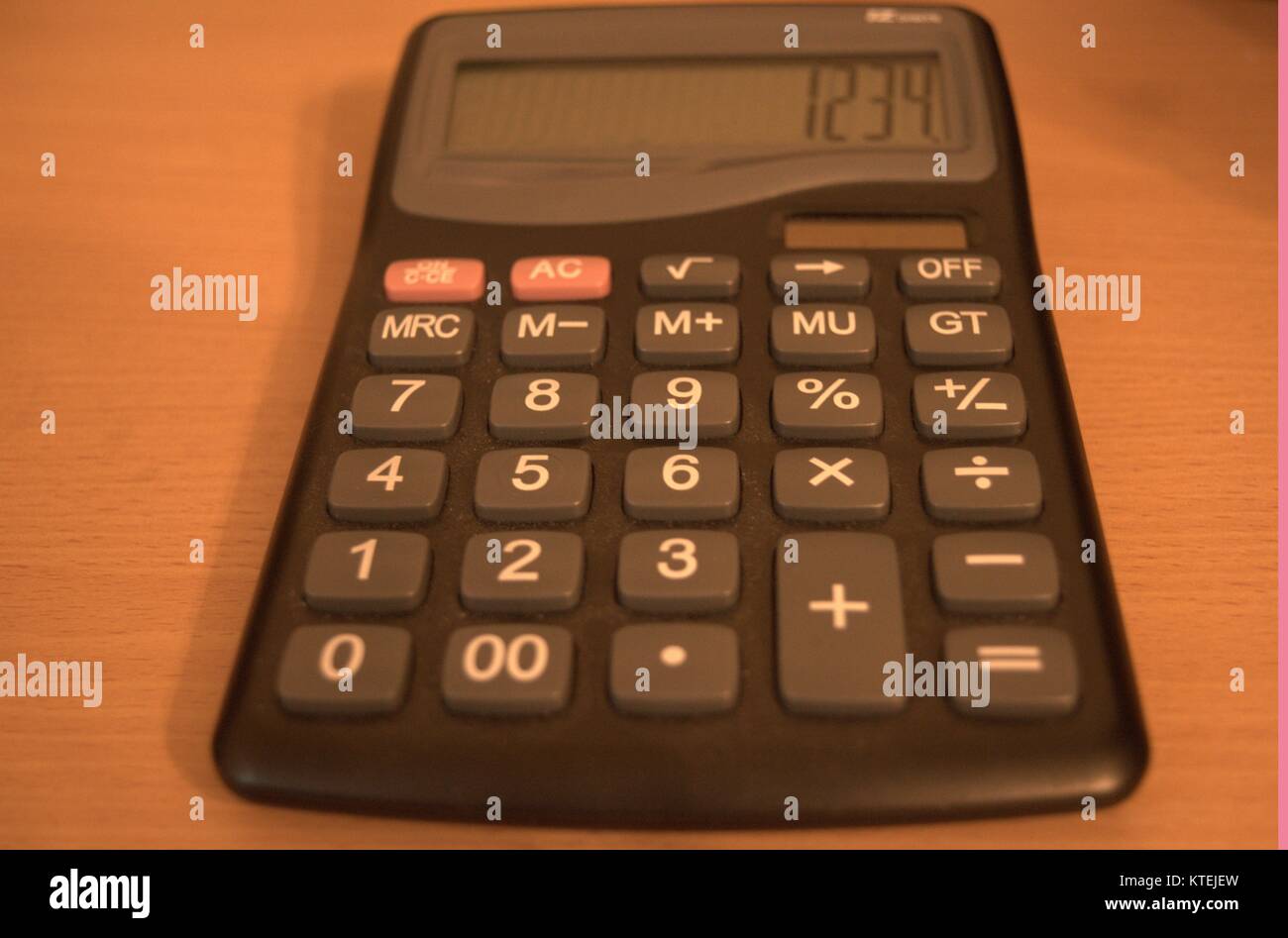 a calculator on desk Stock Photo - Alamy