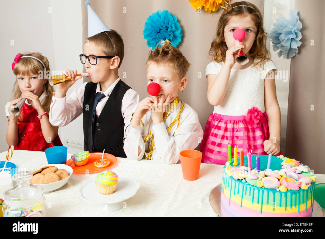 Group of smiling children playing on the birthday party in decorated ...