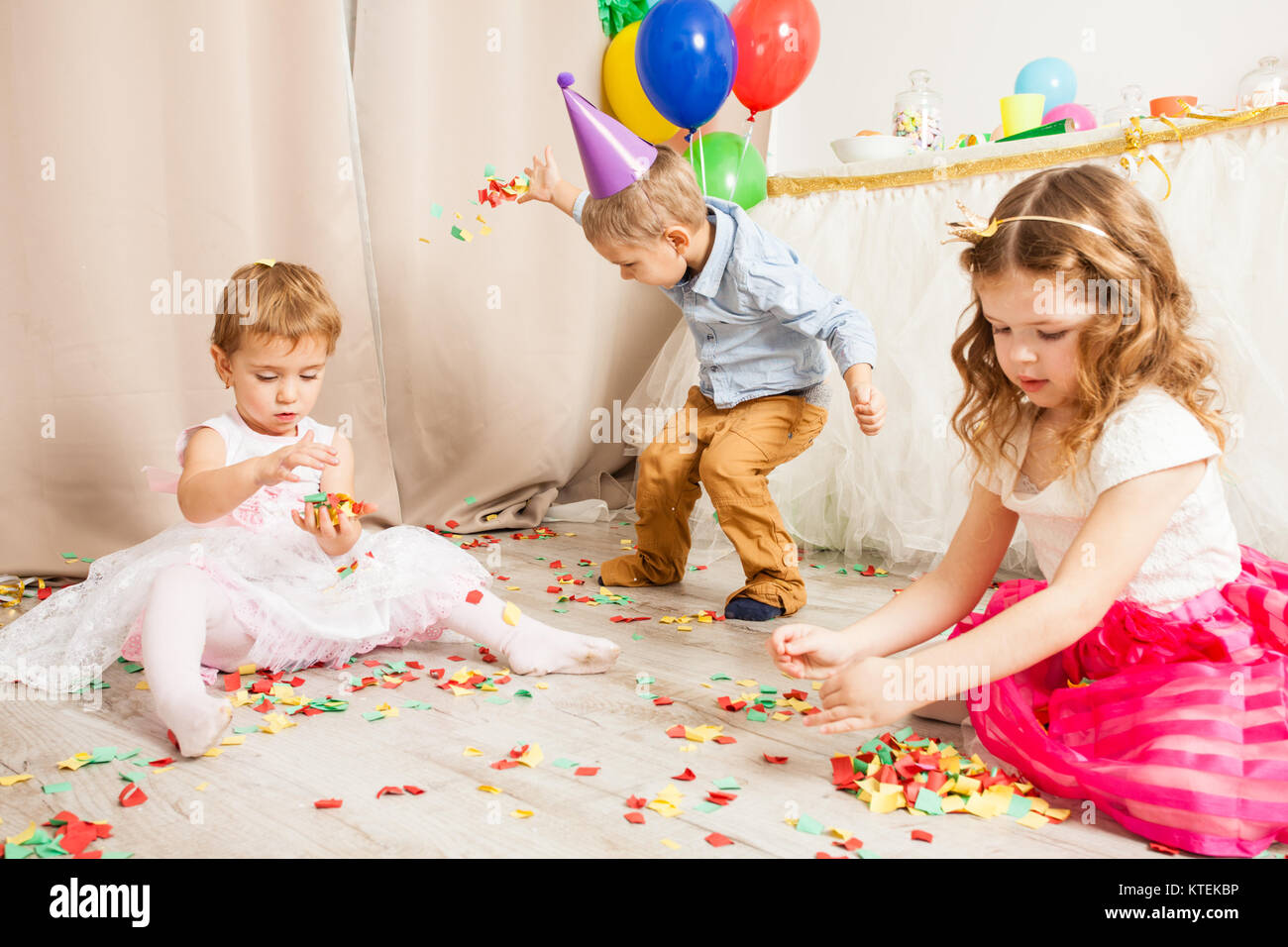 Children are throwing colorful confetti on the birthday party Stock ...