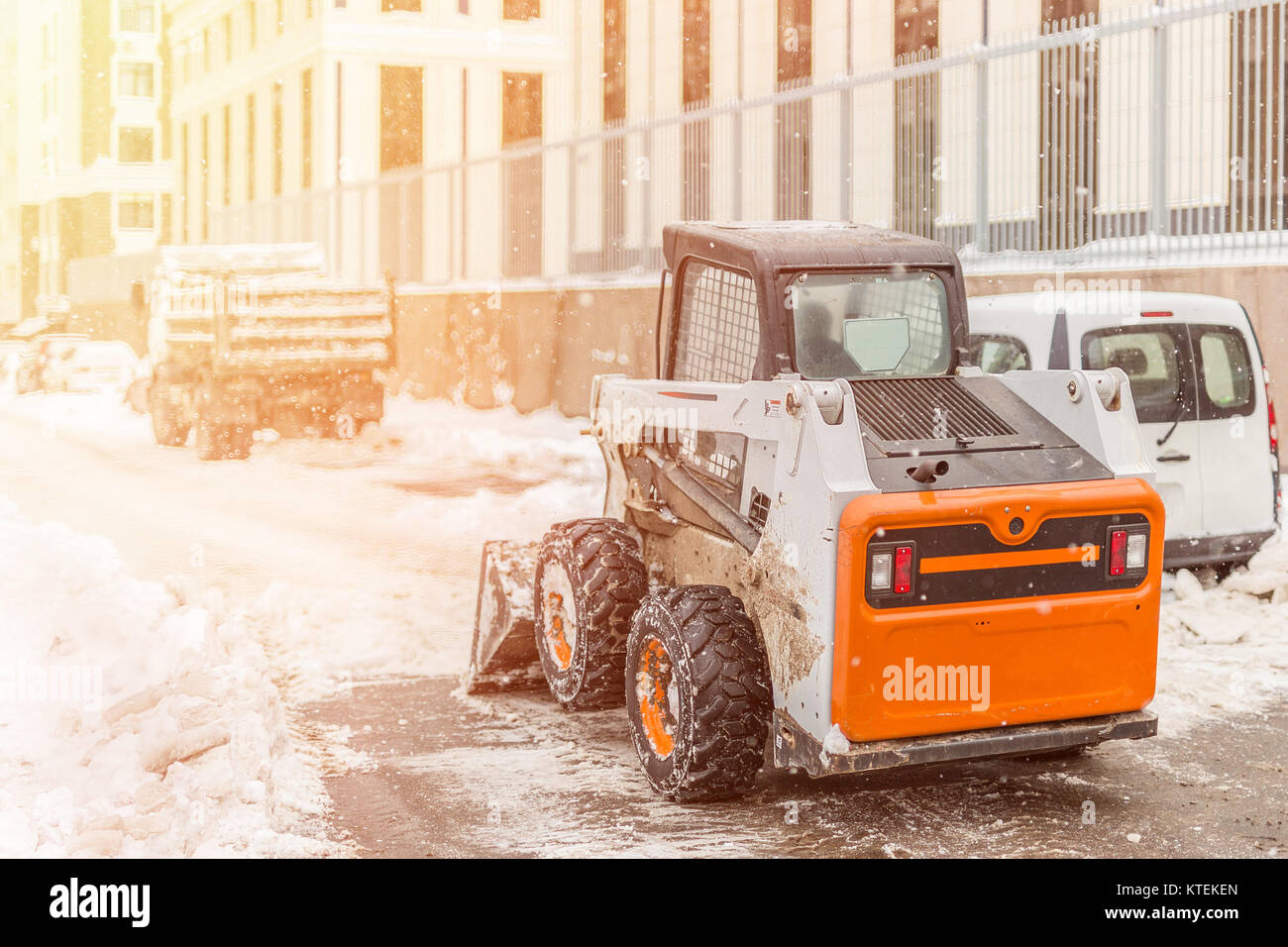 Machine remove snow from a city street Stock Photo - Alamy