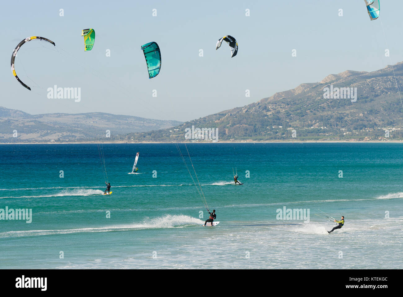 Kitesurfers kiteboarders, wave riding, kitesurf ride waves in coast of ...