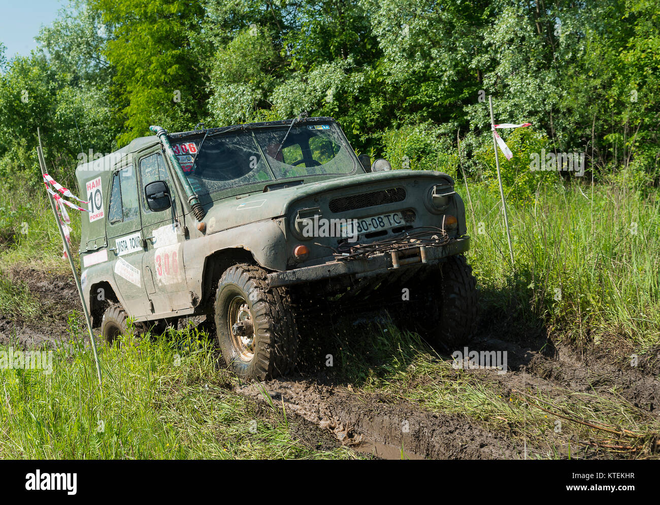 Lviv, Ukraine - May 30, 2015: Off-road vehicle UAZ (No. 306) overcomes ...