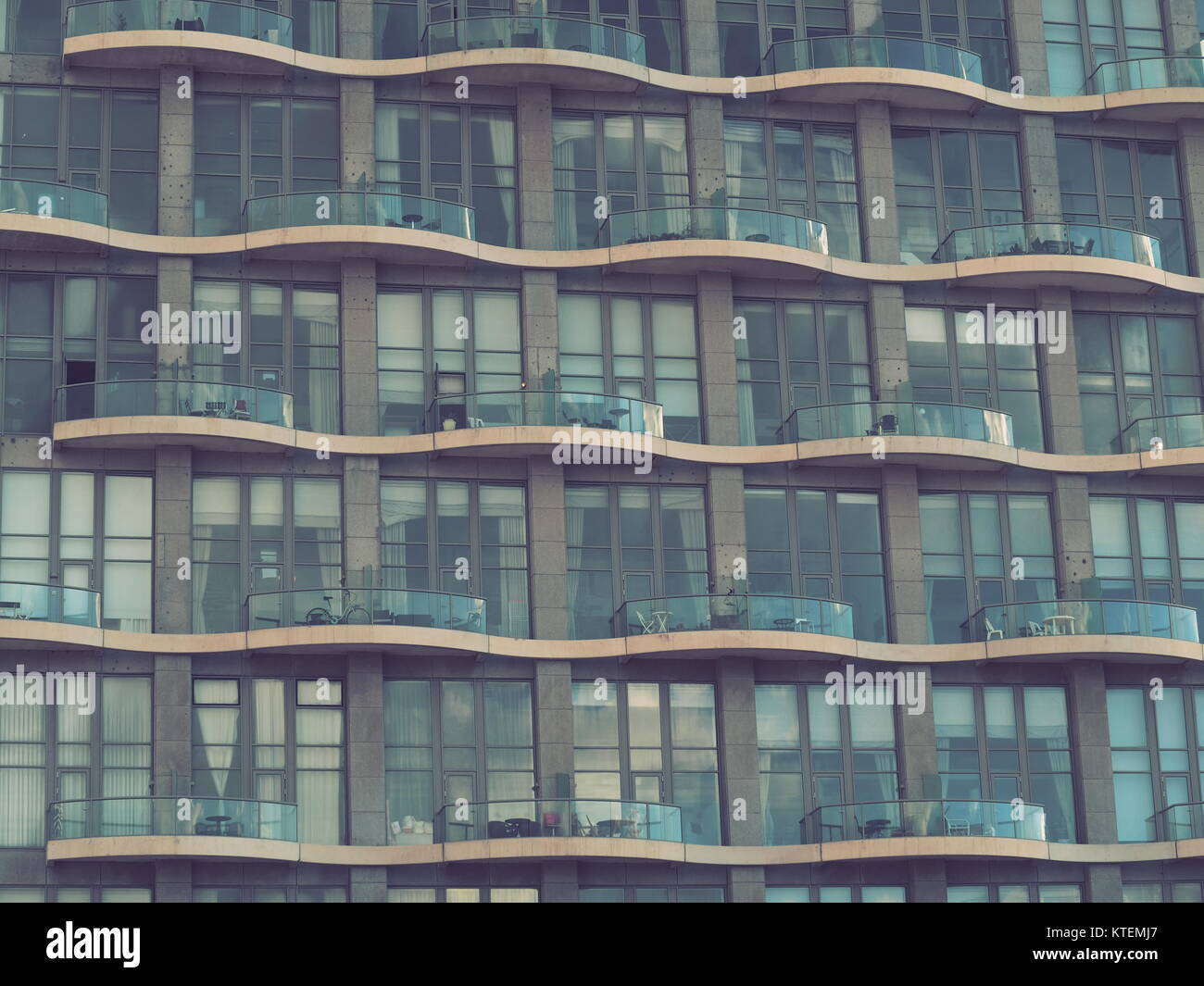 modern residence building facade with waves form balconies Stock Photo ...