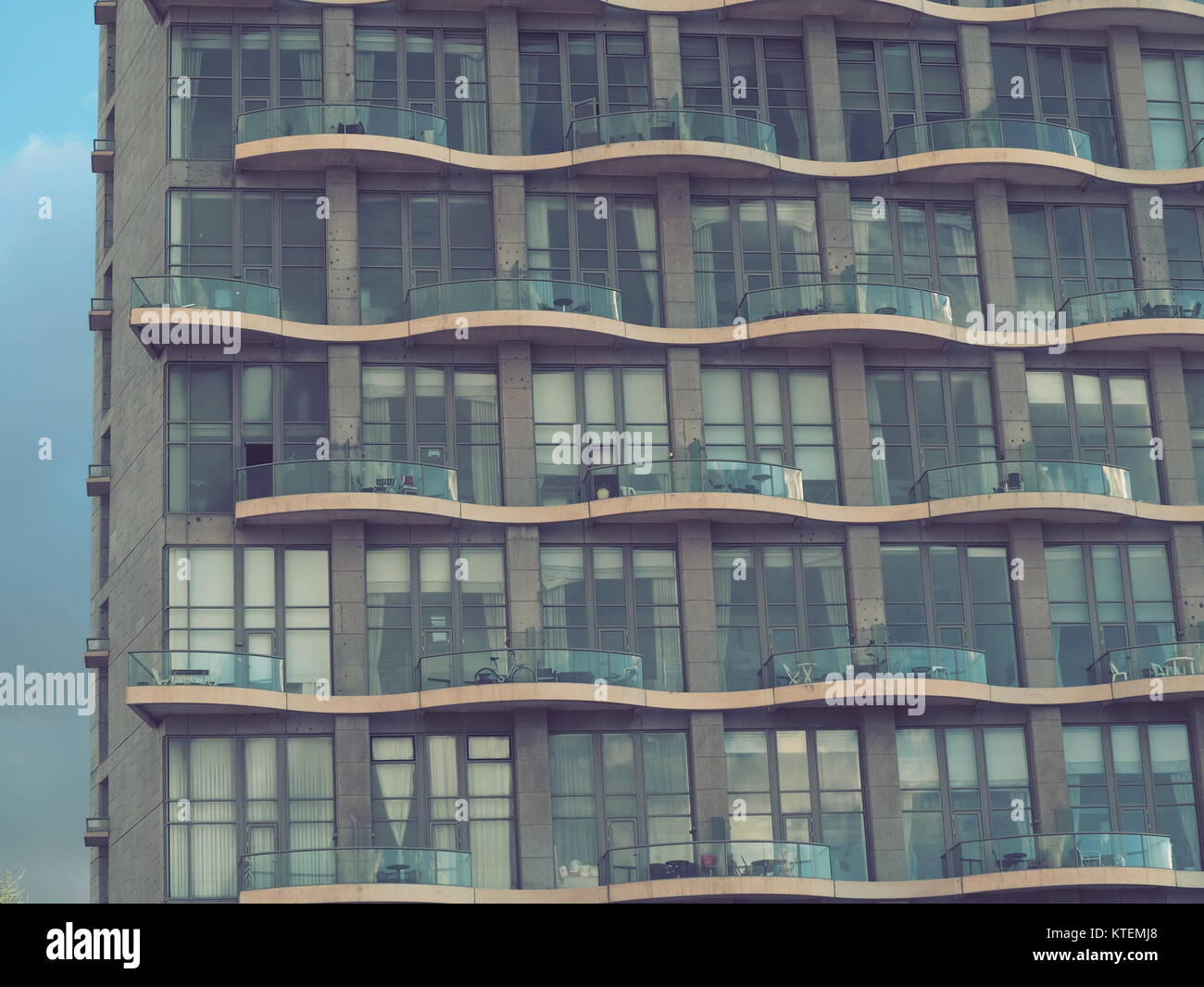 modern residence building facade with waves form balconies Stock Photo ...