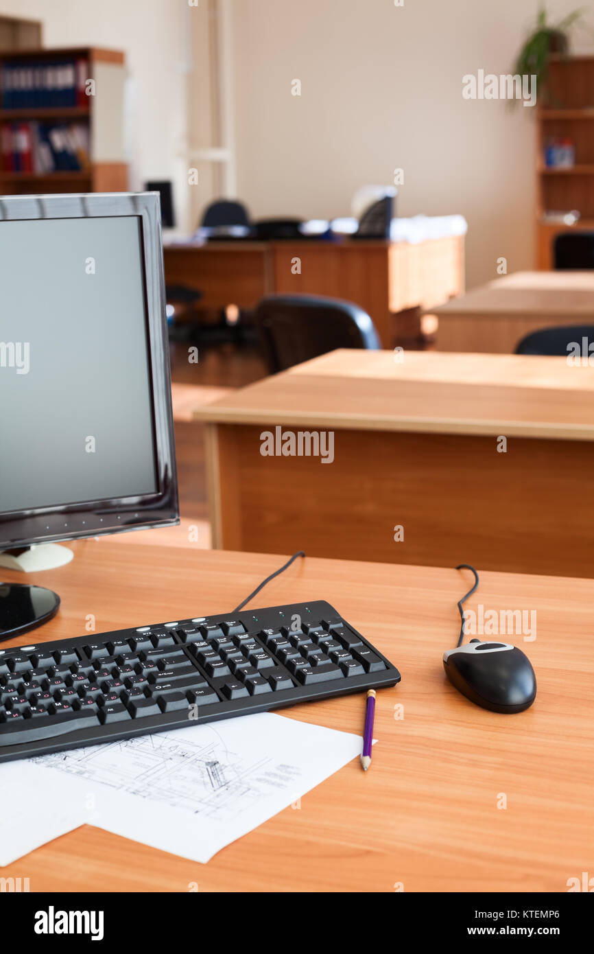 Black off computer monitor with keyboard and mouse are on office desk ...