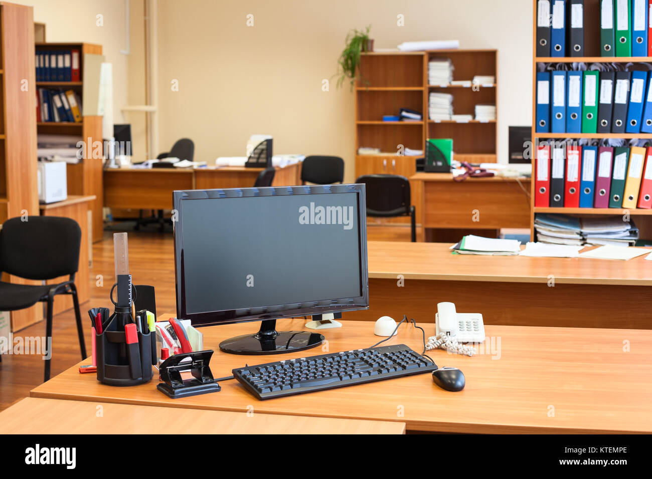 Empty office room with clear working places and off units of computer ...