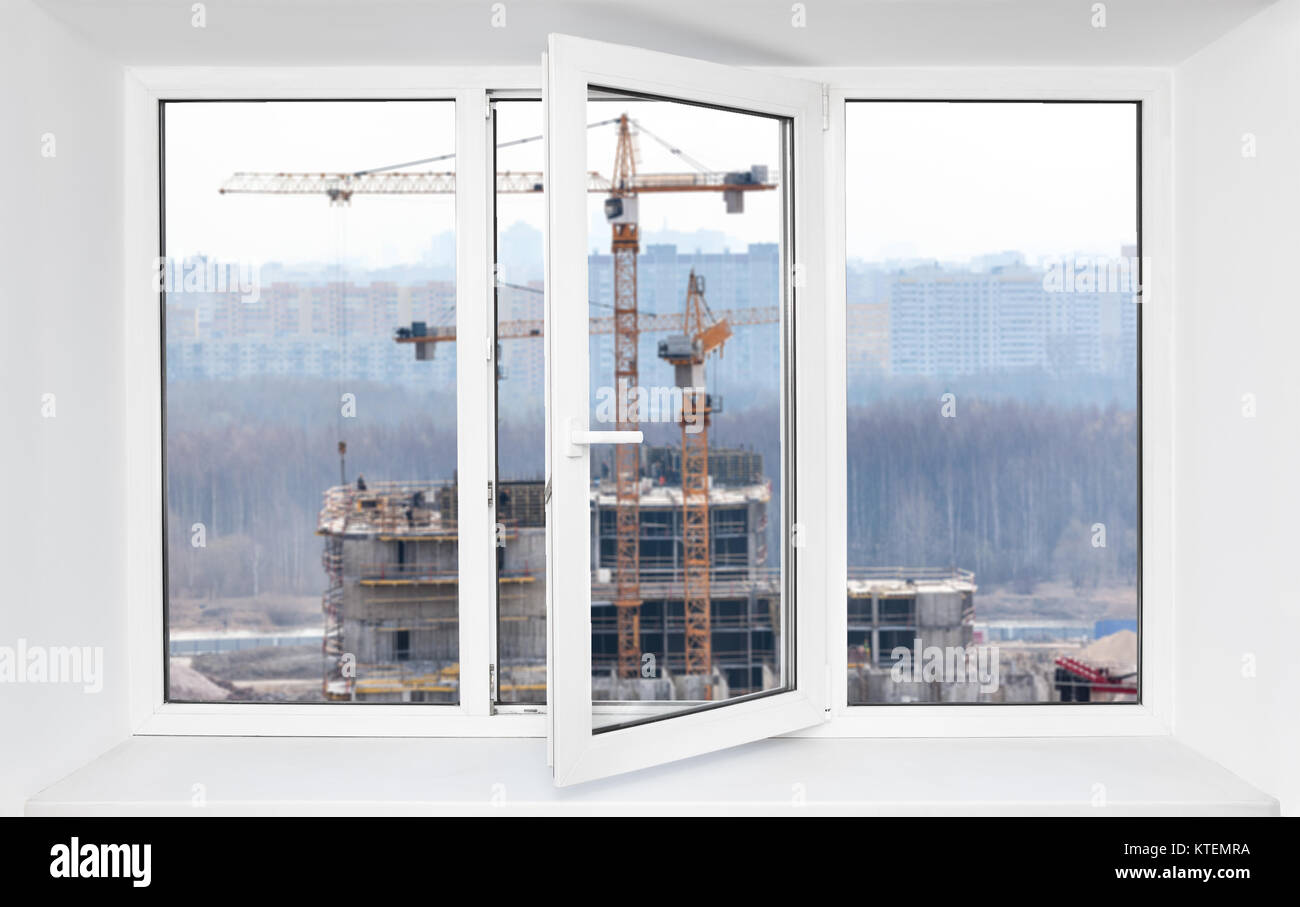 Loud construction site noise immission in opened one frame of white pvc ...