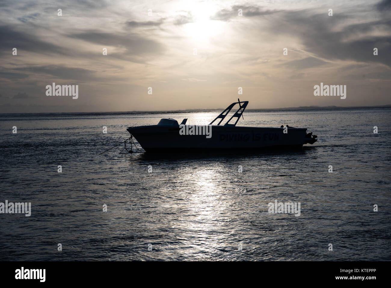 A speedboat on the Indian Ocen,Mauritius at sunset Stock Photo - Alamy