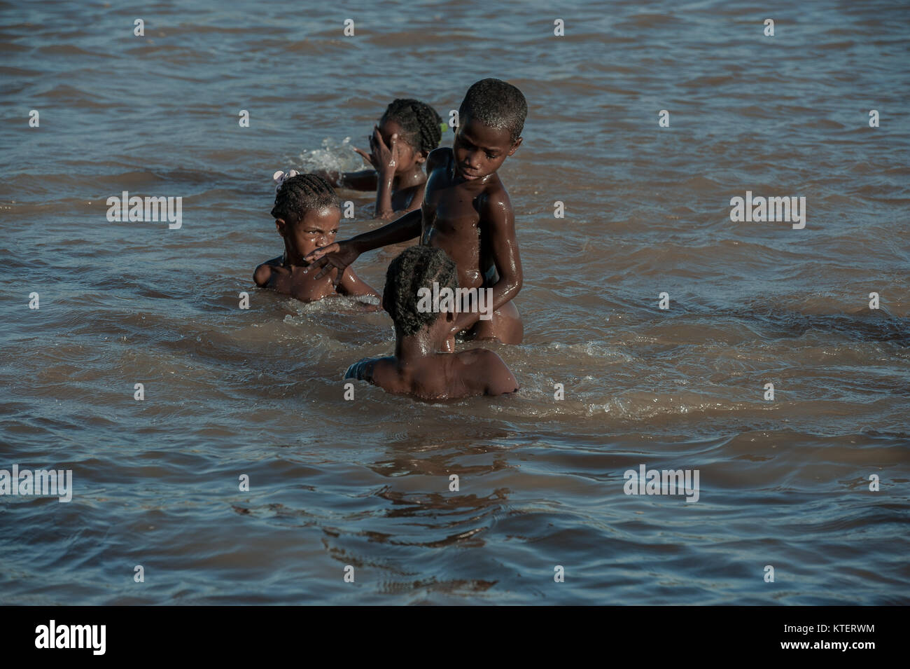 A family washes in the Manambolo river, near Ankavandra, Madagascar ...