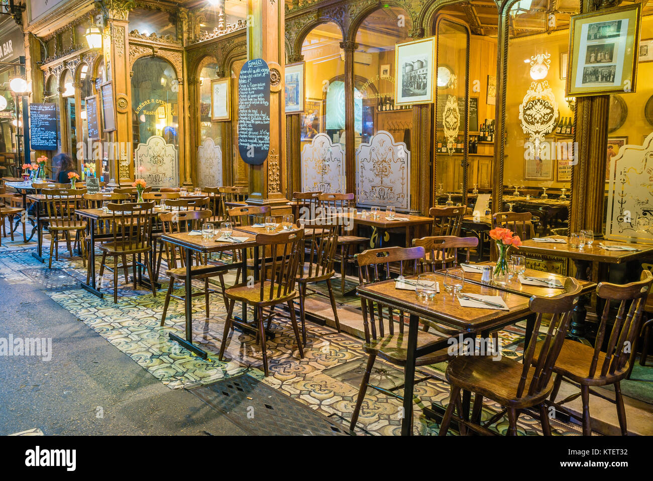 A restaurant terrace of a bar in Paris, at night Stock Photo - Alamy