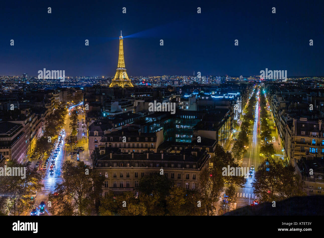 Illuminated Eiffel tower at night seen from the Arc de Triomphe in Paris Stock Photo - Alamy