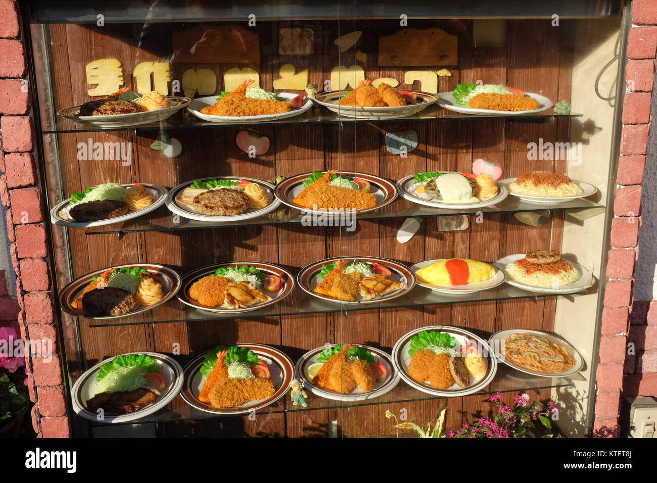 A displays of plastic food models showing what's on the menu in a ...