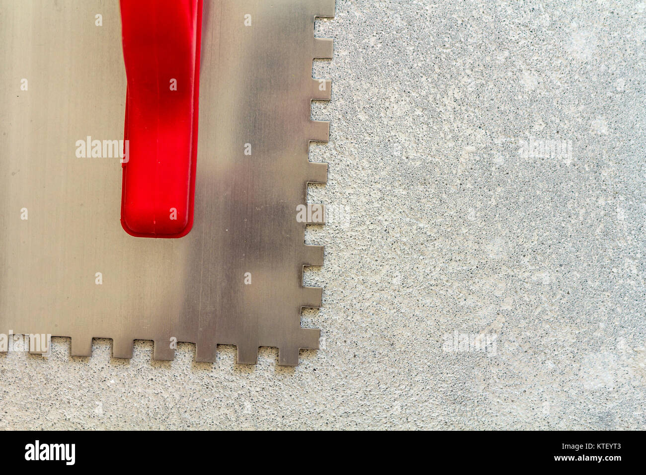 Construction notched trowel is a tool for tiles installation work Stock ...