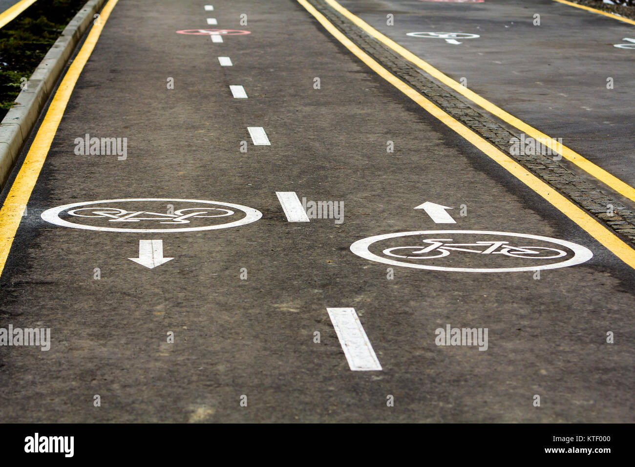 Walk way and bicycle lane signs on the asphalt road surface Stock Photo ...