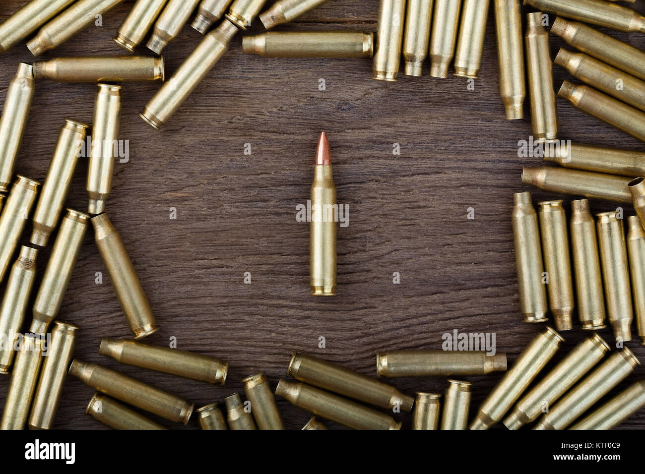Rifle bullets on wood table with low key scene. Close-up photo Stock ...