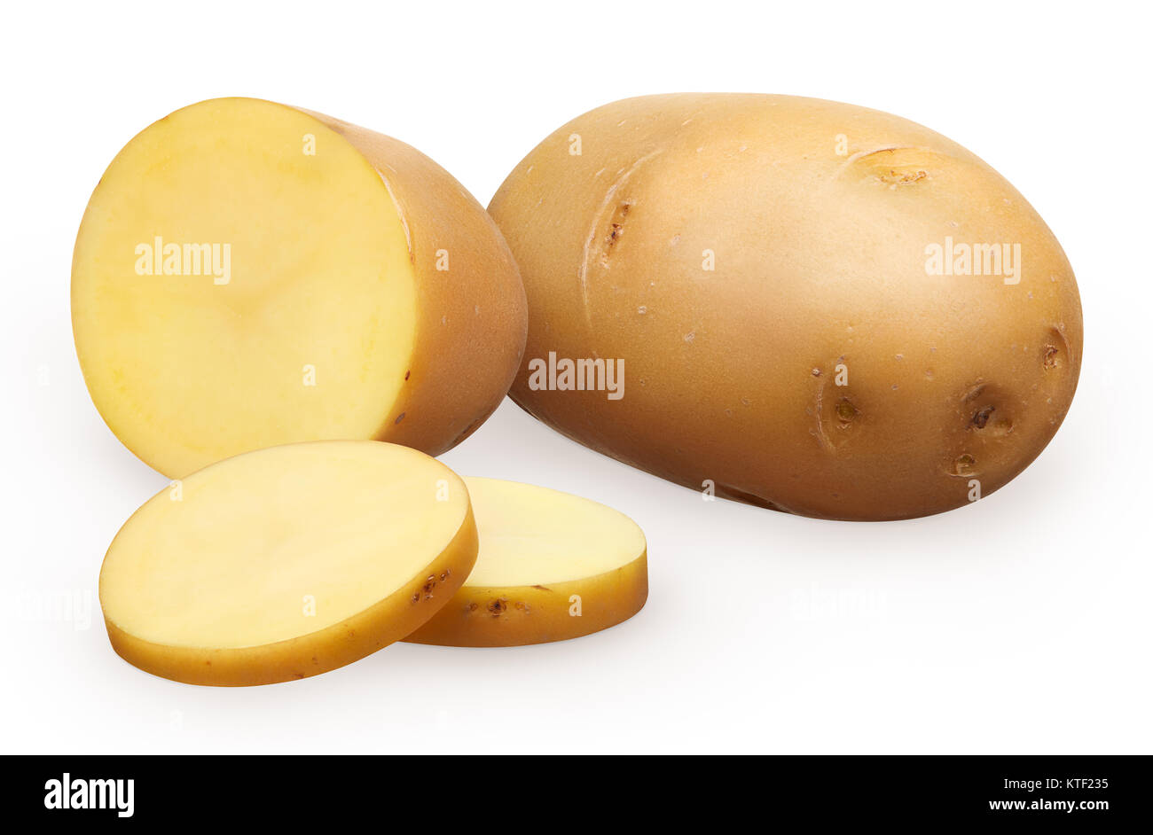 Whole fresh unpeeled potato, half and two chopped pieces isolated on ...
