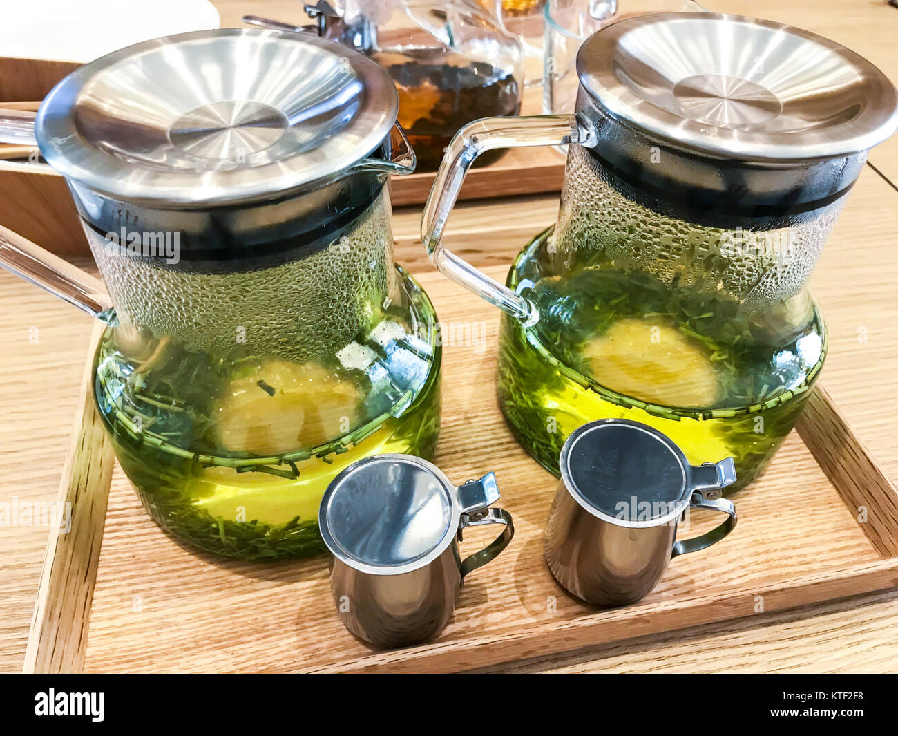 Green tea in jug on tray. Studio Photo Stock Photo - Alamy