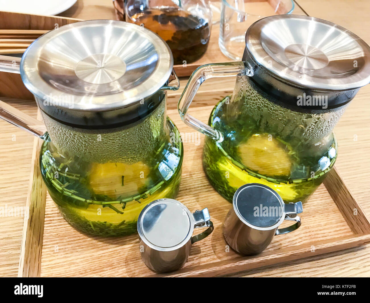 Green tea in jug on tray. Studio Photo Stock Photo - Alamy