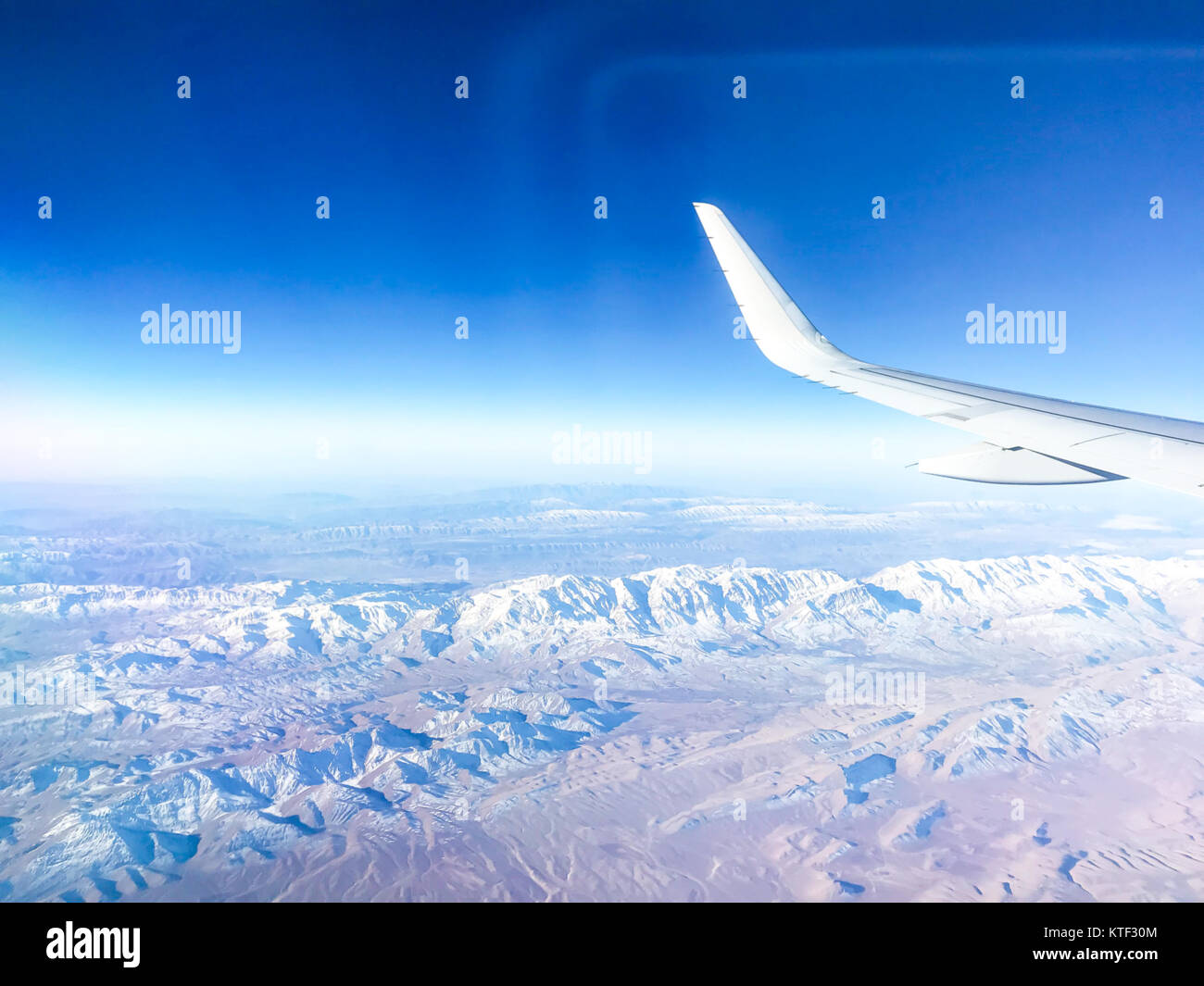 Mountains in the airplane window. Studio Photo Stock Photo - Alamy