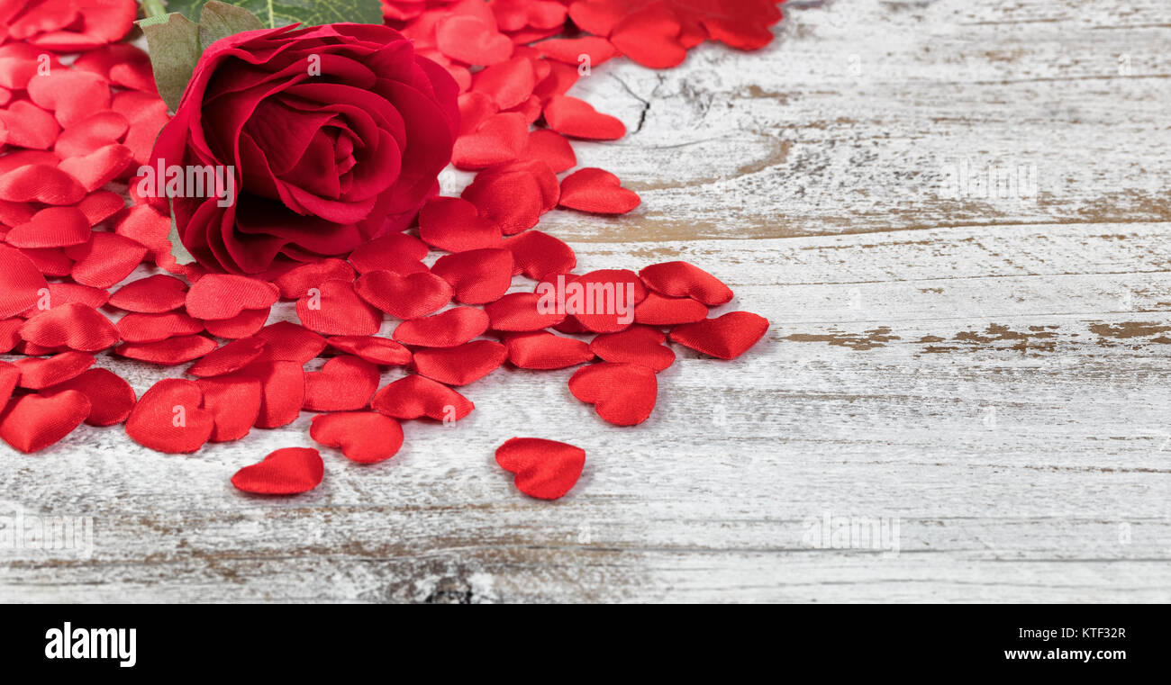 Close up of a single red rose and heart shapes in background Stock ...