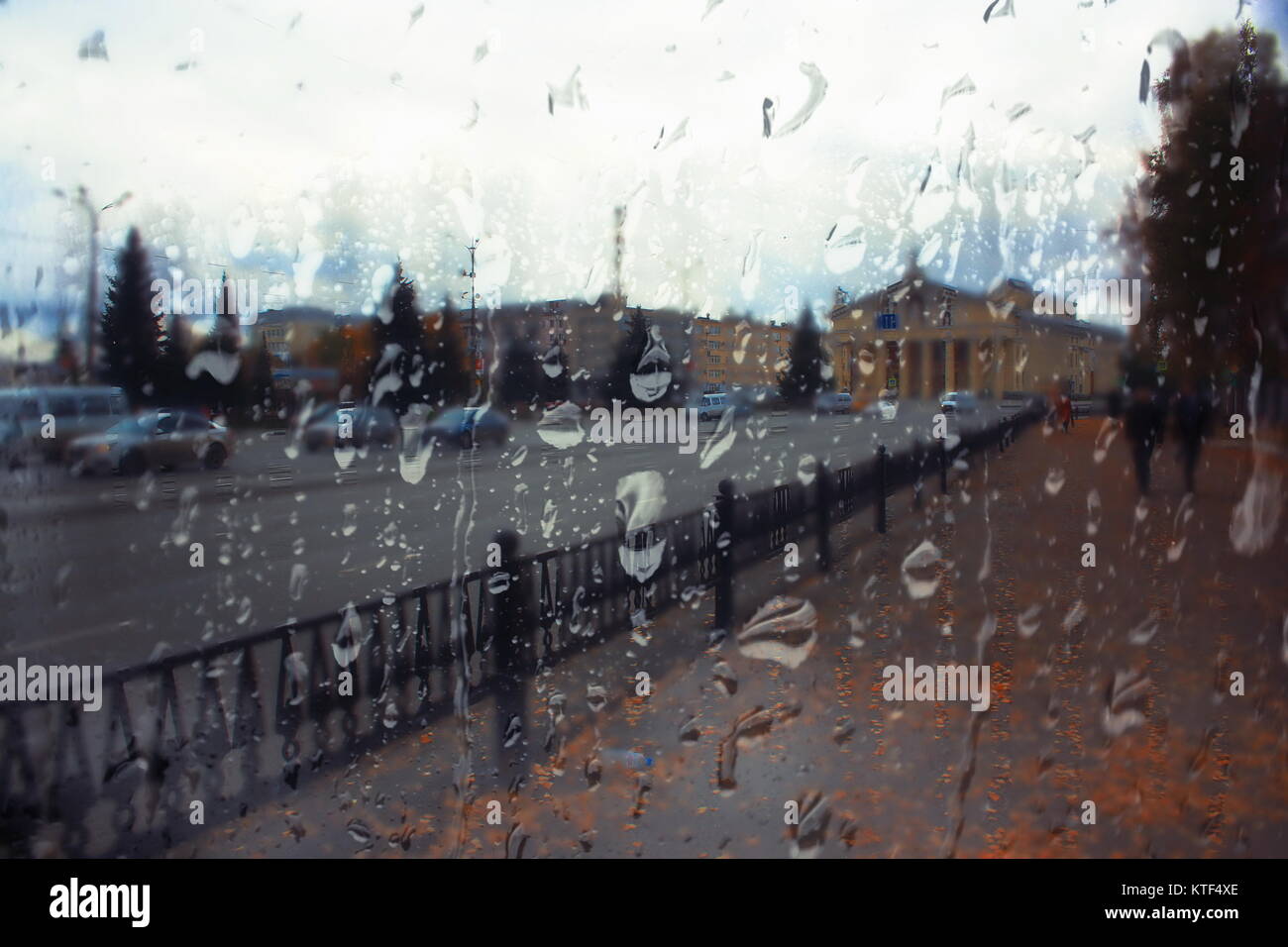 Autumn street on a rainy day view through wet glass Stock Photo - Alamy