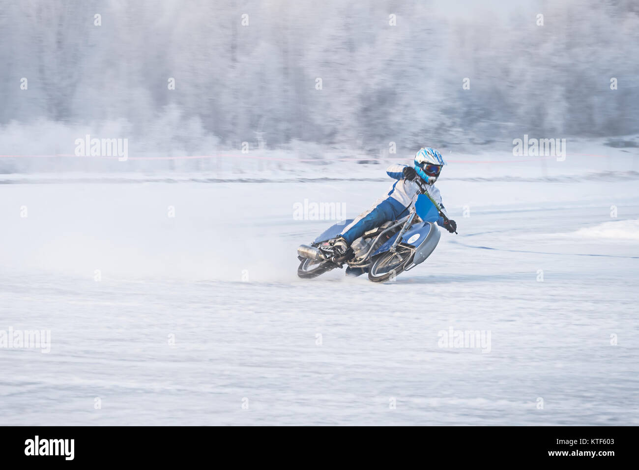Winter Speedway. Racers unmarked drive on the ice road in the open air ...