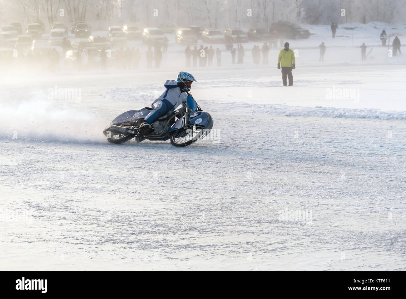 Siberian winter Speedway. Cyclist on a circular ice track is included ...