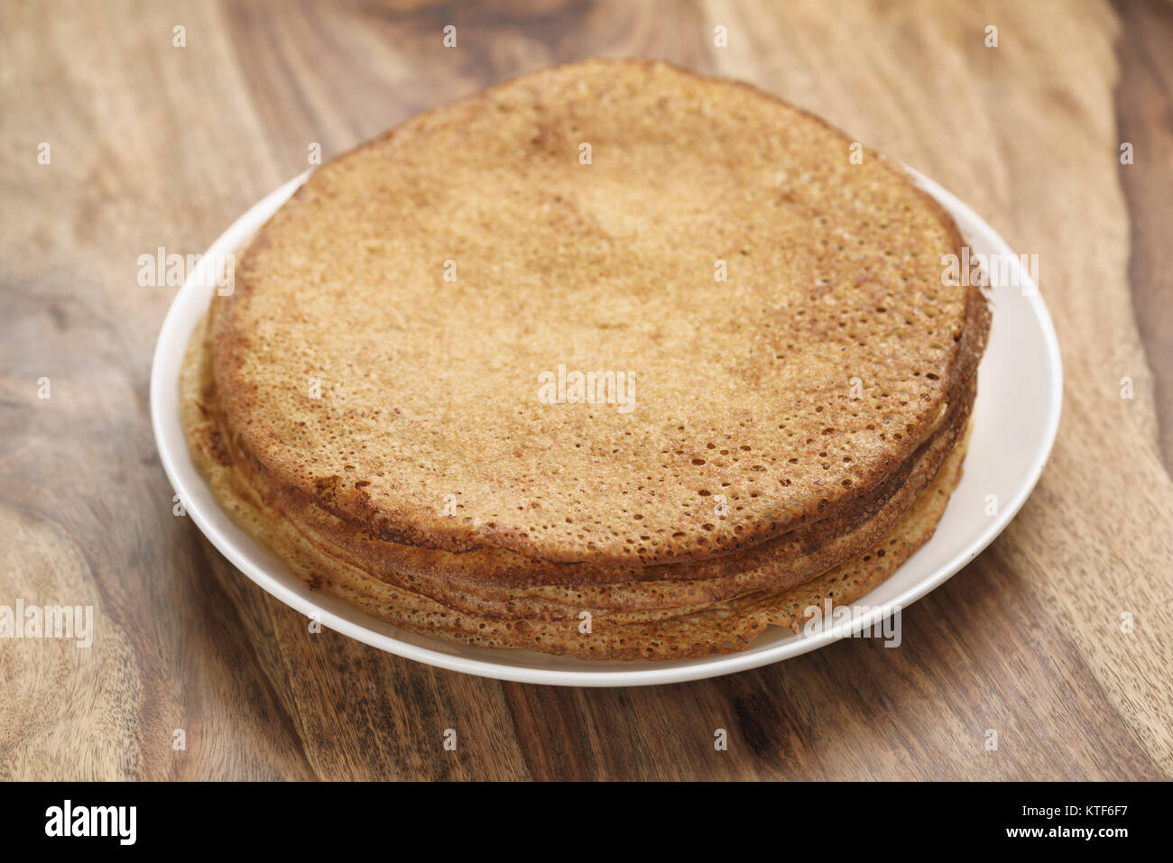 homemade crepes on plate on wood table Stock Photo - Alamy