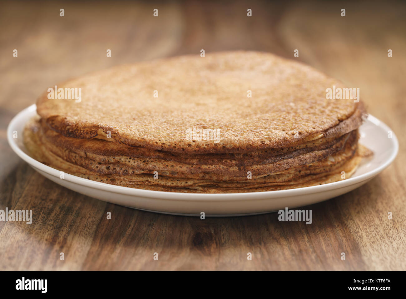 homemade crepes on plate on wood table Stock Photo - Alamy