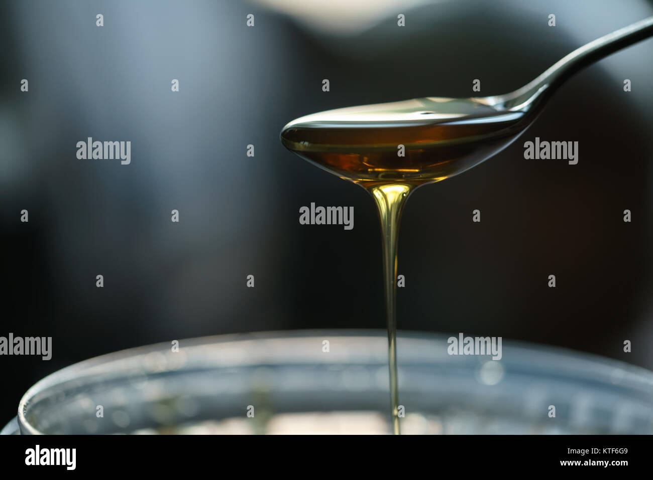 Honey spoon dripping hi-res stock photography and images - Alamy
