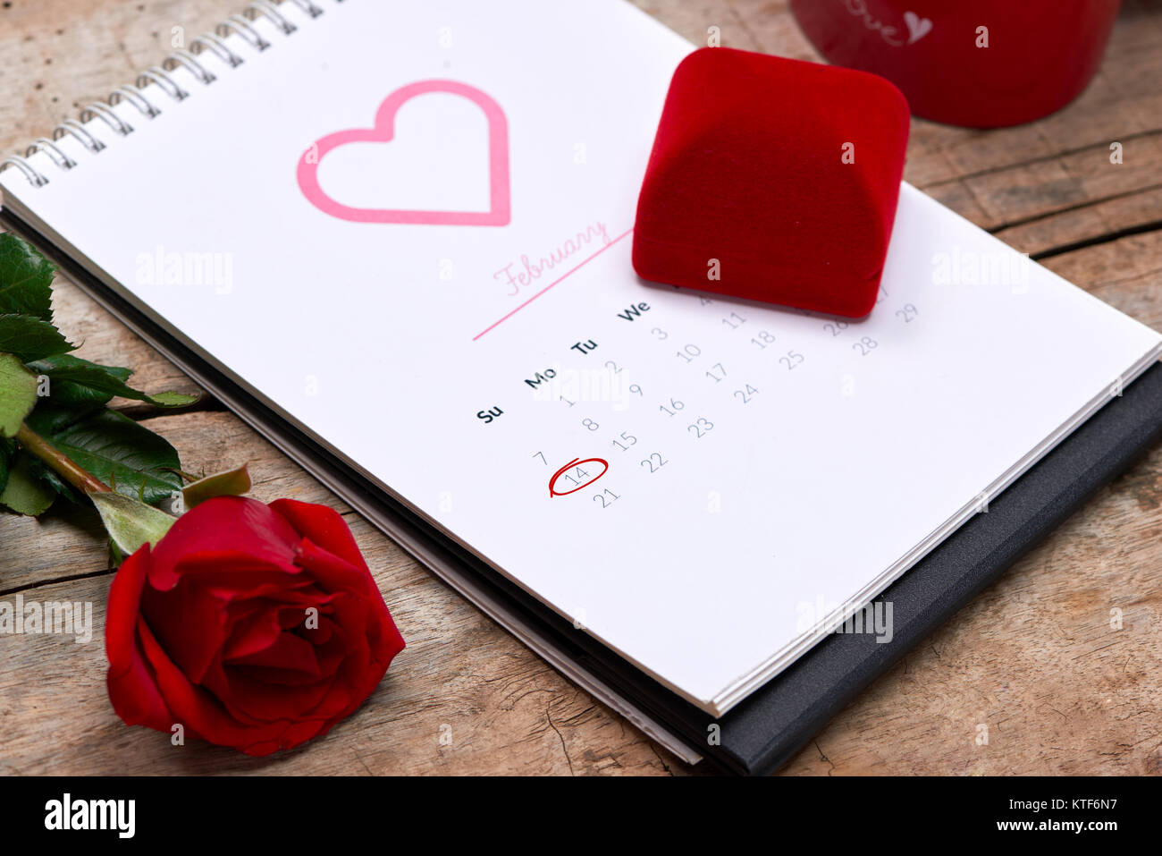 Calendar showing the date 14th of February. Red rose, hearts and gift ...