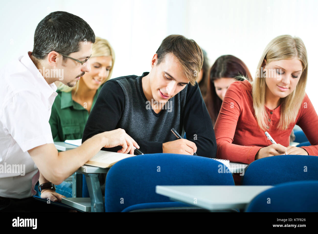 Students in class with professor Stock Photo - Alamy
